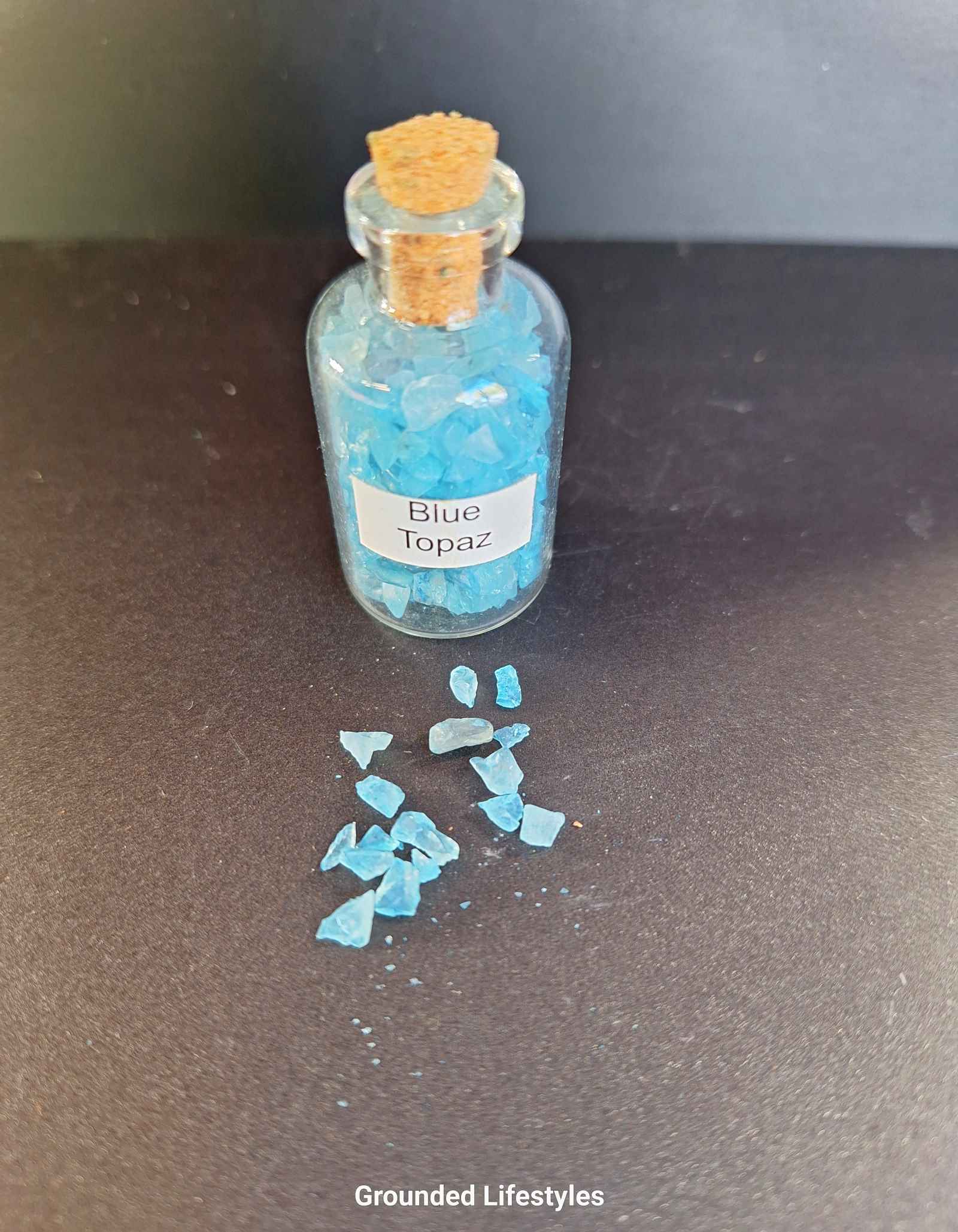 Enhance Your Zen Garden with the Blue Topaz Gemstone Bottle - Grounded ...